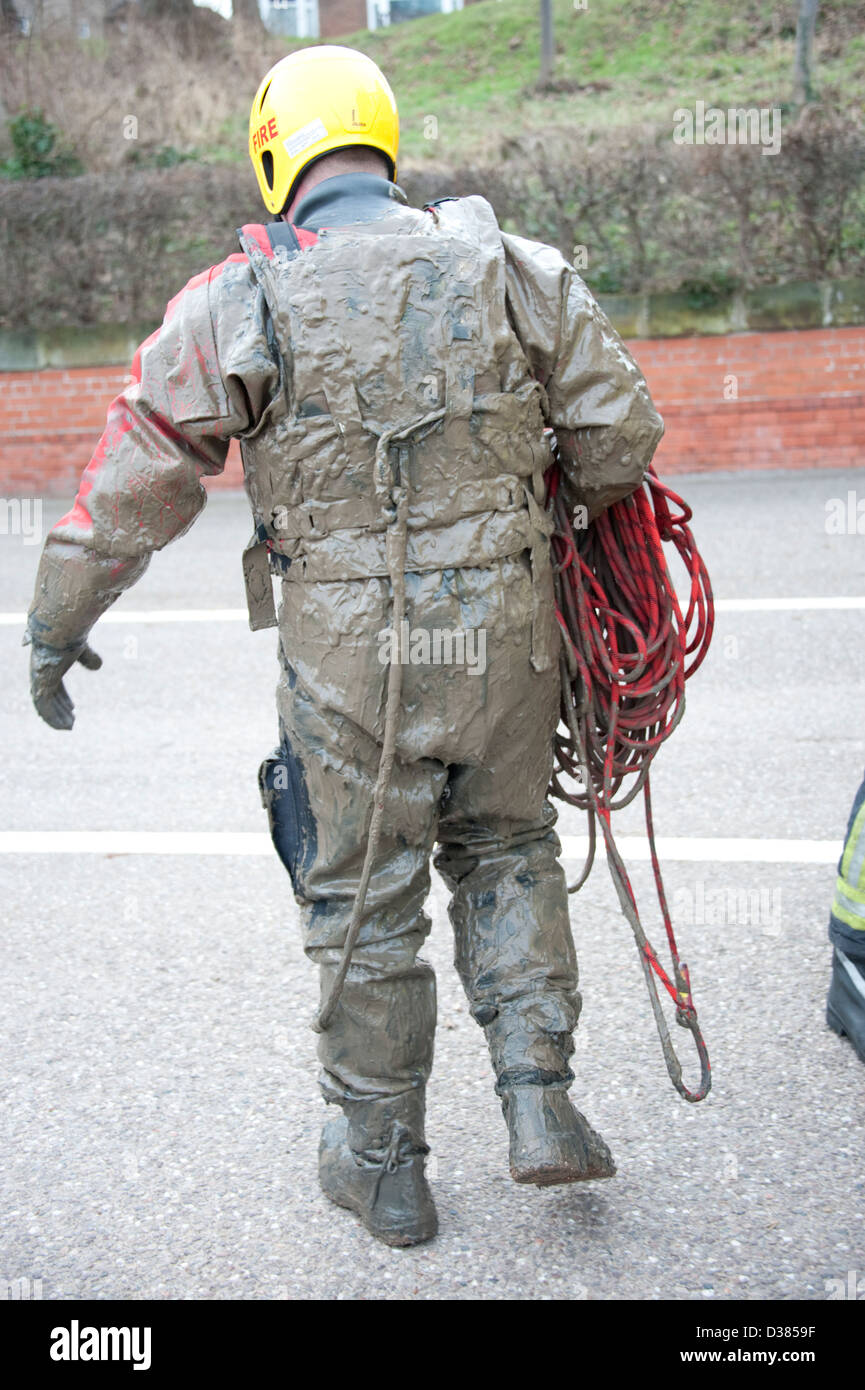 Firefighter USAR covered in thick mud rescue beach Stock Photo - Alamy