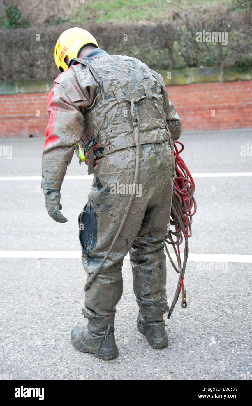 Firefighter USAR covered in thick mud rescue beach Stock Photo - Alamy