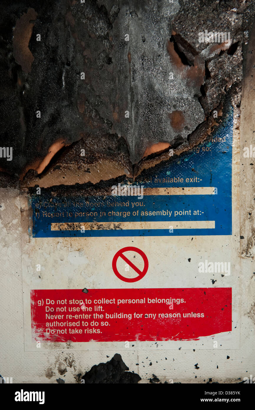 Fire Action Safety Sign Partly burnt in School fire Stock Photo - Alamy