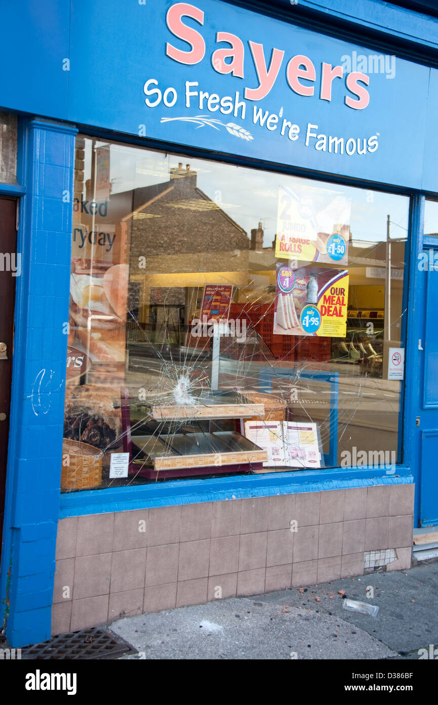 Smashed shop window sayers bakers vandalism Stock Photo - Alamy