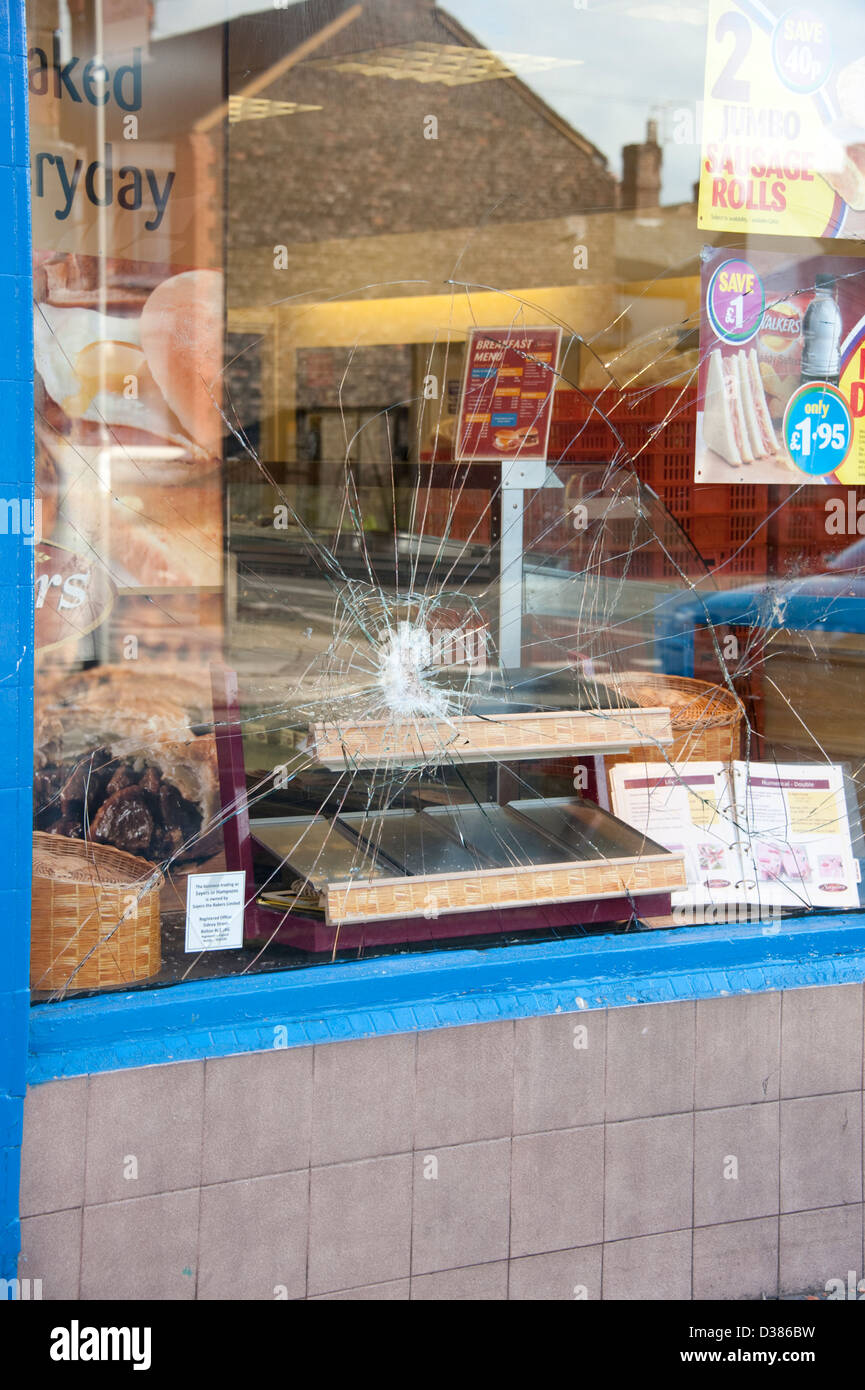 Smashed shop window vandalism Stock Photo - Alamy