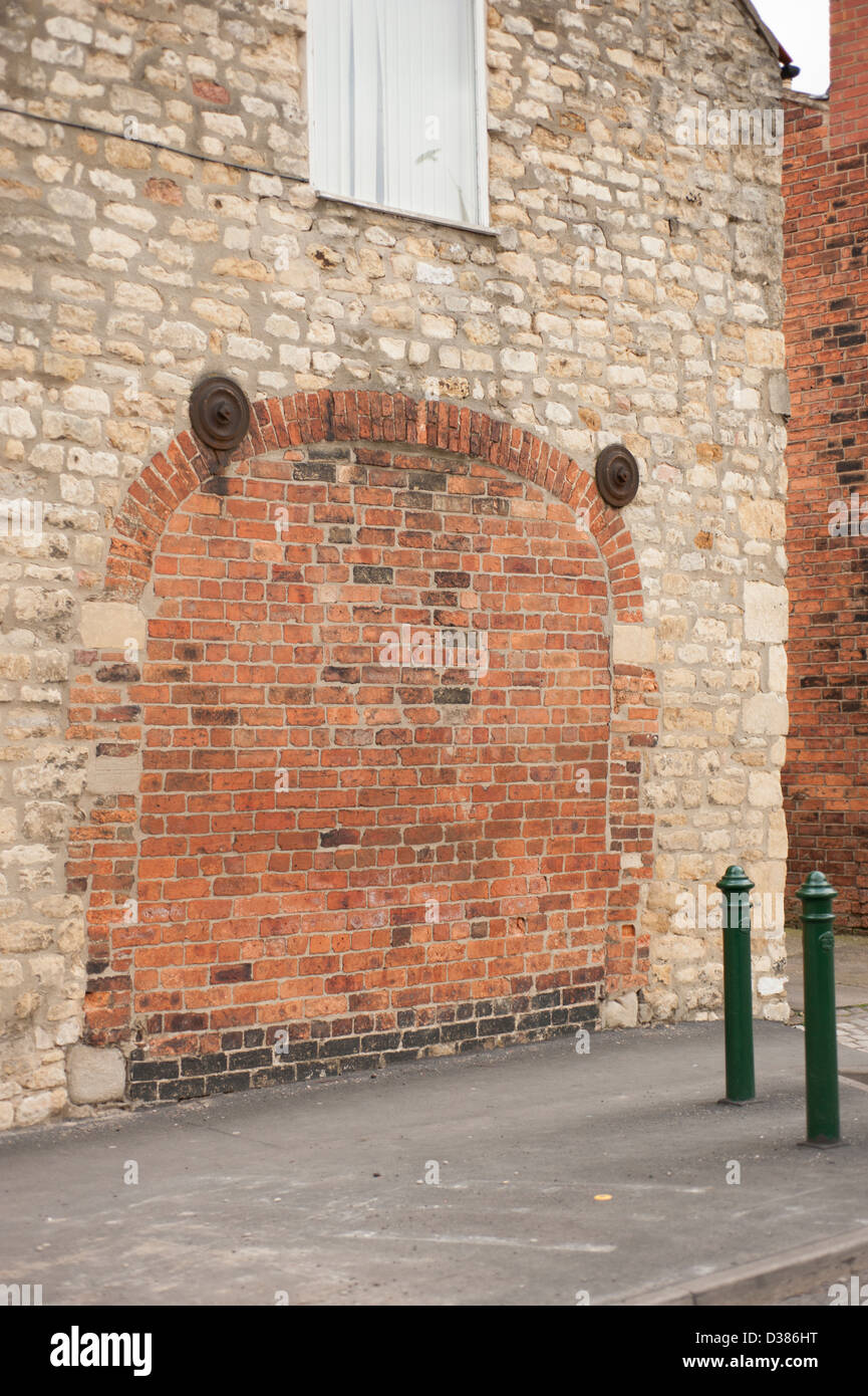 Old bricked up stable coach archway Stock Photo - Alamy