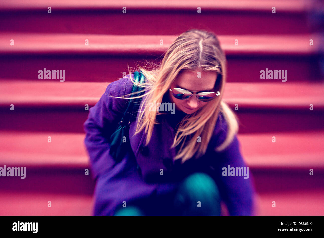 Young Woman sitting on a stoop in New York City Stock Photo - Alamy