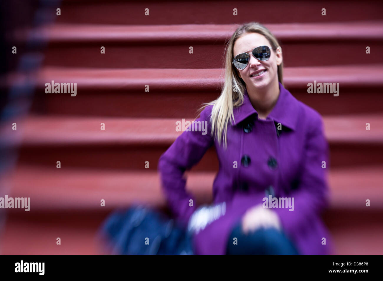 Young Woman sitting on a stoop in New York City Stock Photo - Alamy