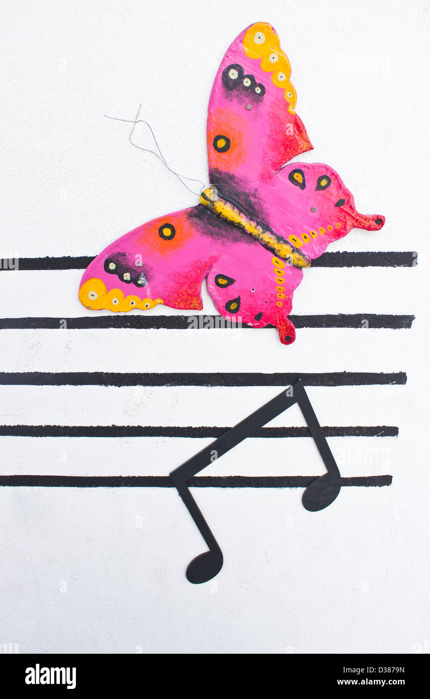 Music note with pink butterfly on white background Stock Photo - Alamy
