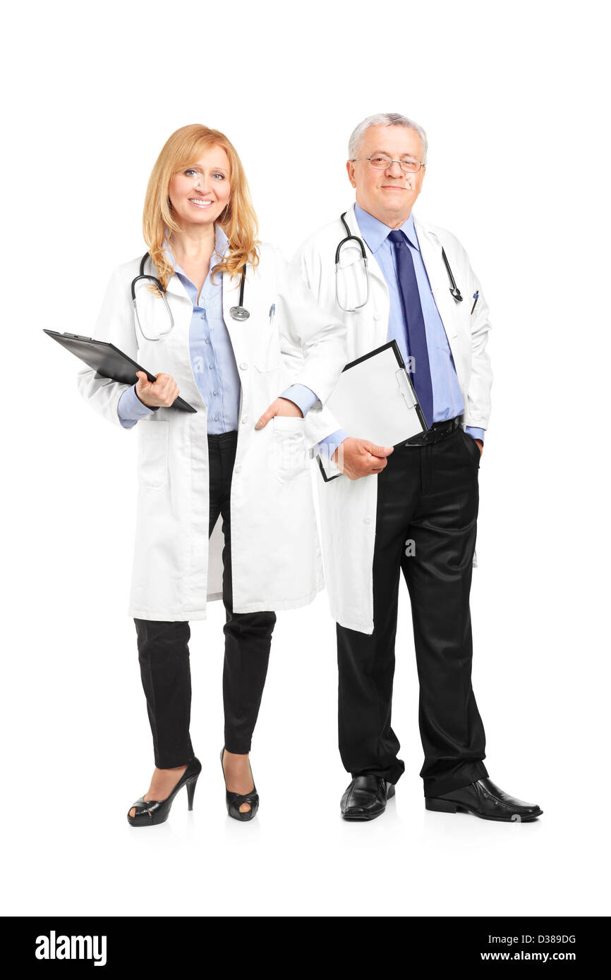 Full length portrait of a team of doctors holding a clipboard and ...