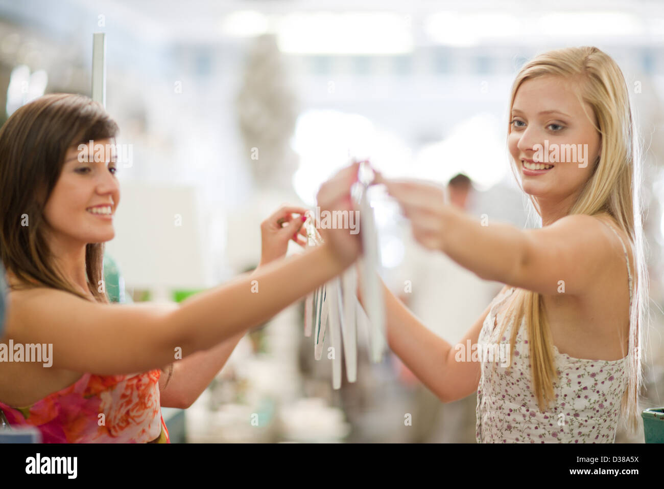 Women shopping together in store Stock Photo - Alamy