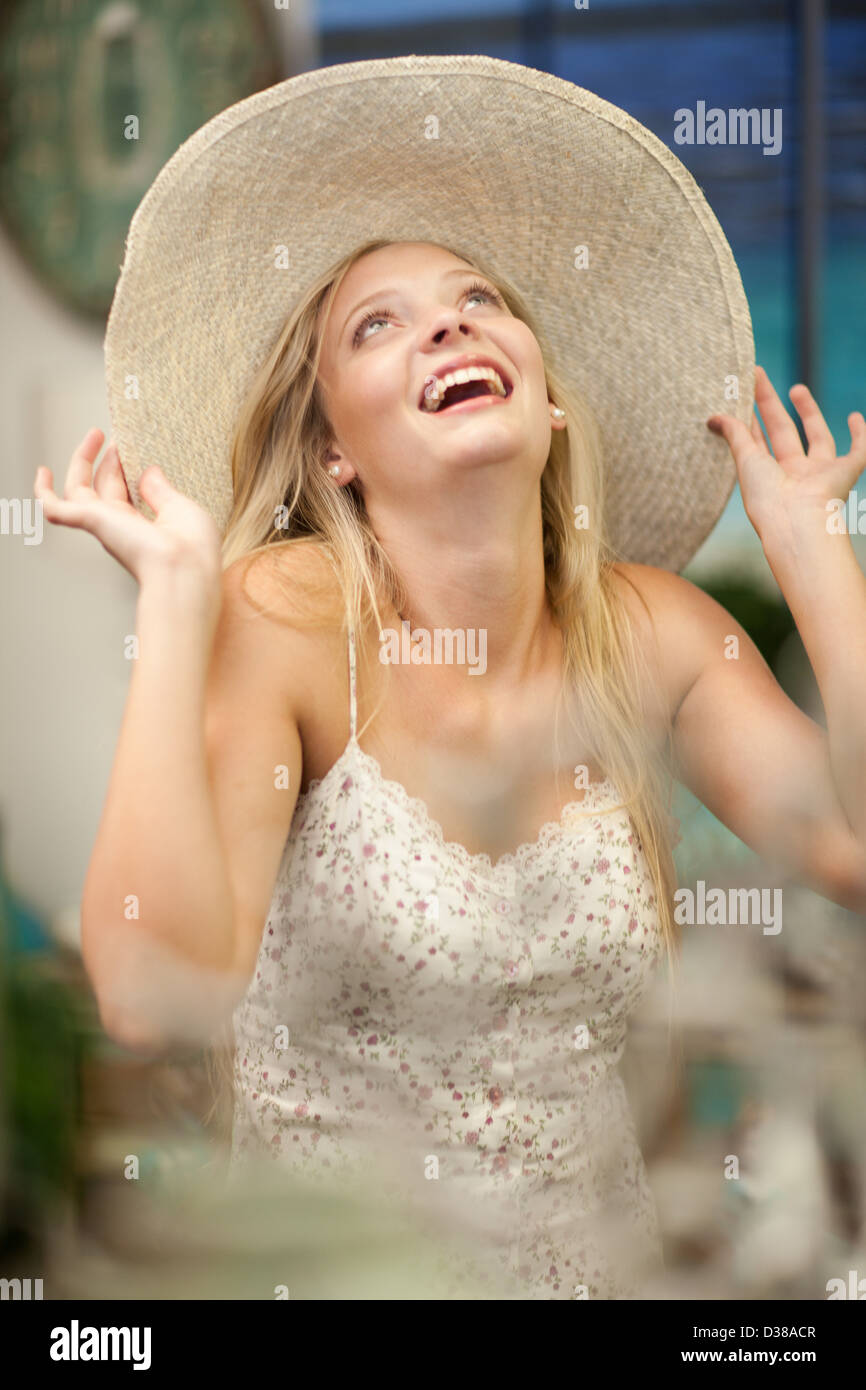 Smiling woman shopping in store Stock Photo - Alamy