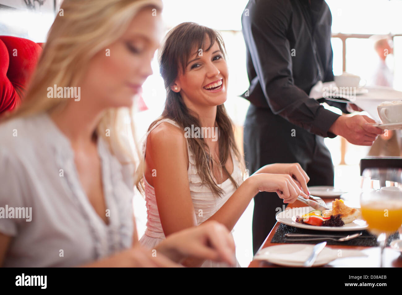 Woman serving breakfast cafe hi-res stock photography and images - Alamy