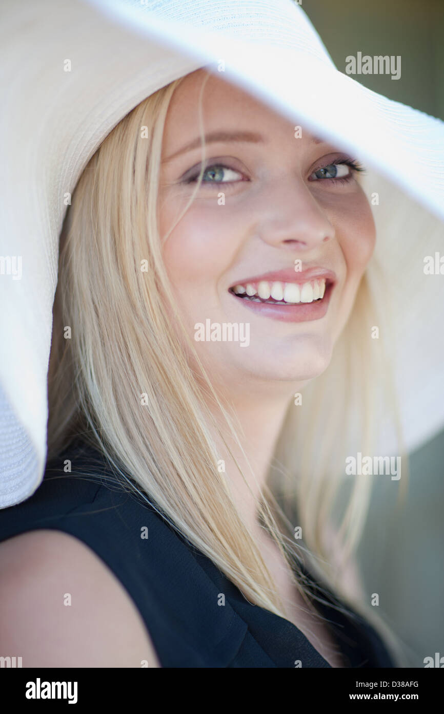 Smiling side by side looking at camera fashion hat hi-res stock ...