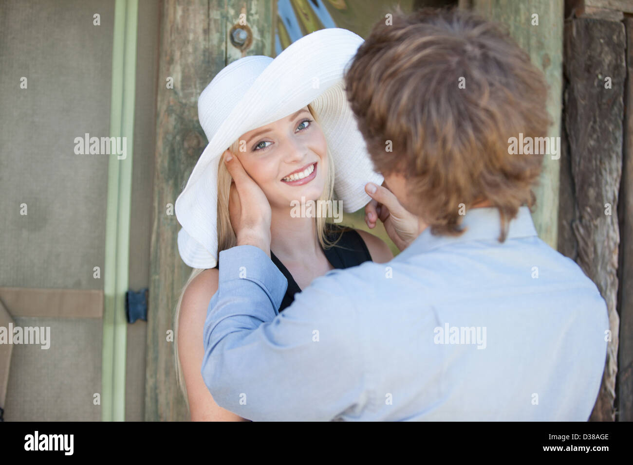 Adjusting hat hi-res stock photography and images - Alamy