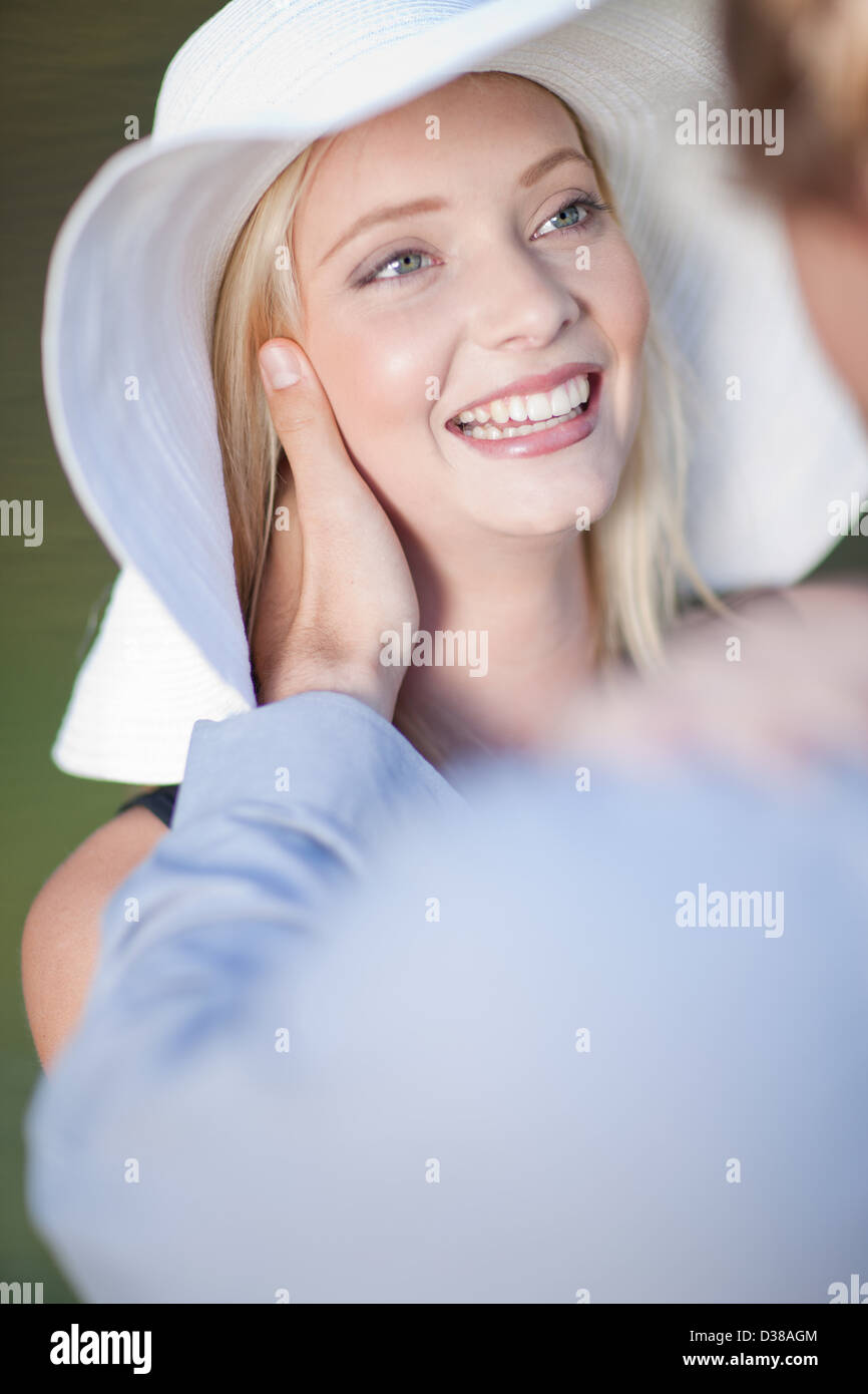 Adjusting hat hi-res stock photography and images - Alamy