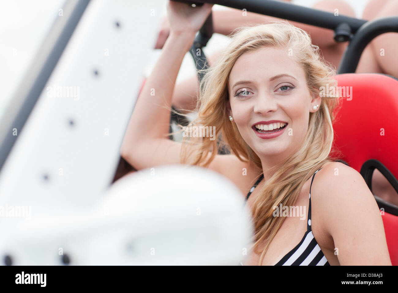 Smiling woman riding in jeep Stock Photo - Alamy
