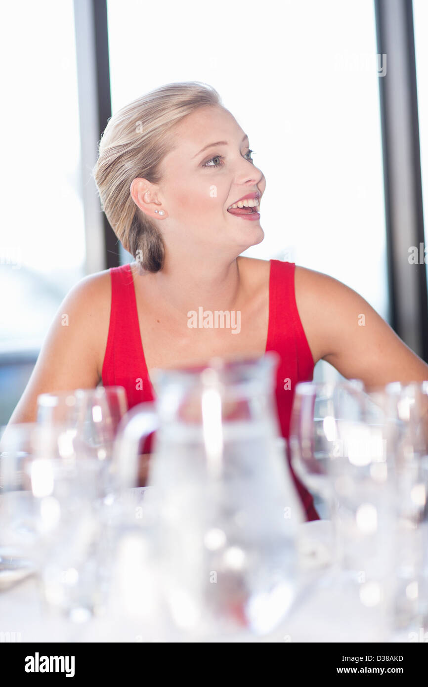 Woman having dinner at restaurant Stock Photo - Alamy
