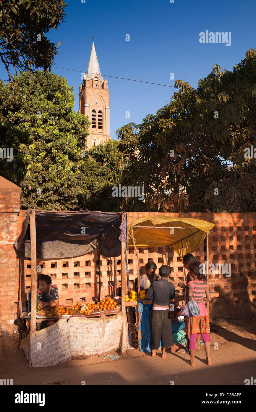 Madagascar, Ambalavao, fruit stalls below church tower Stock Photo - Alamy
