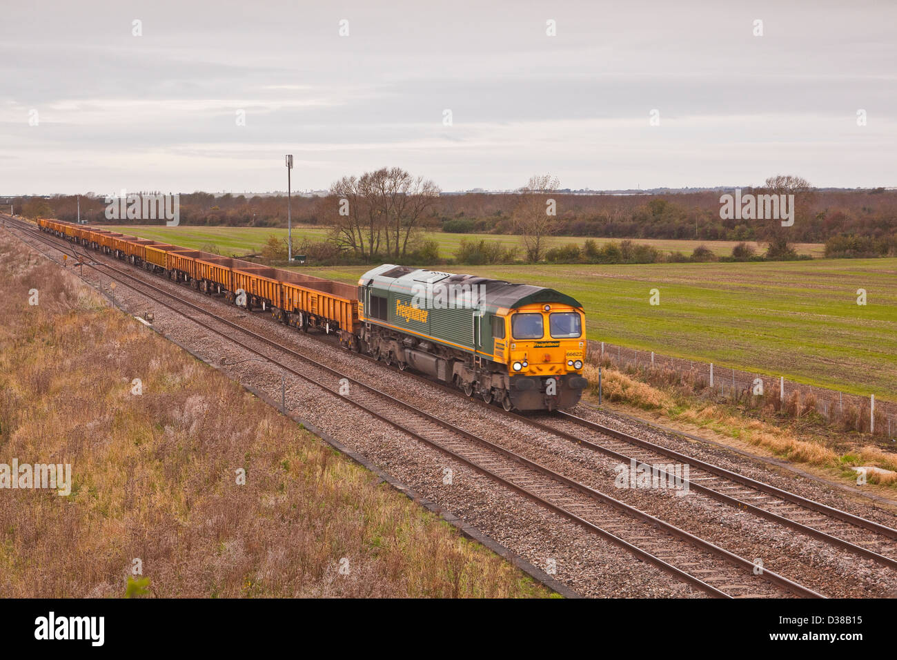 A freightliner diesel locomotive with permanent way wagons on the ...