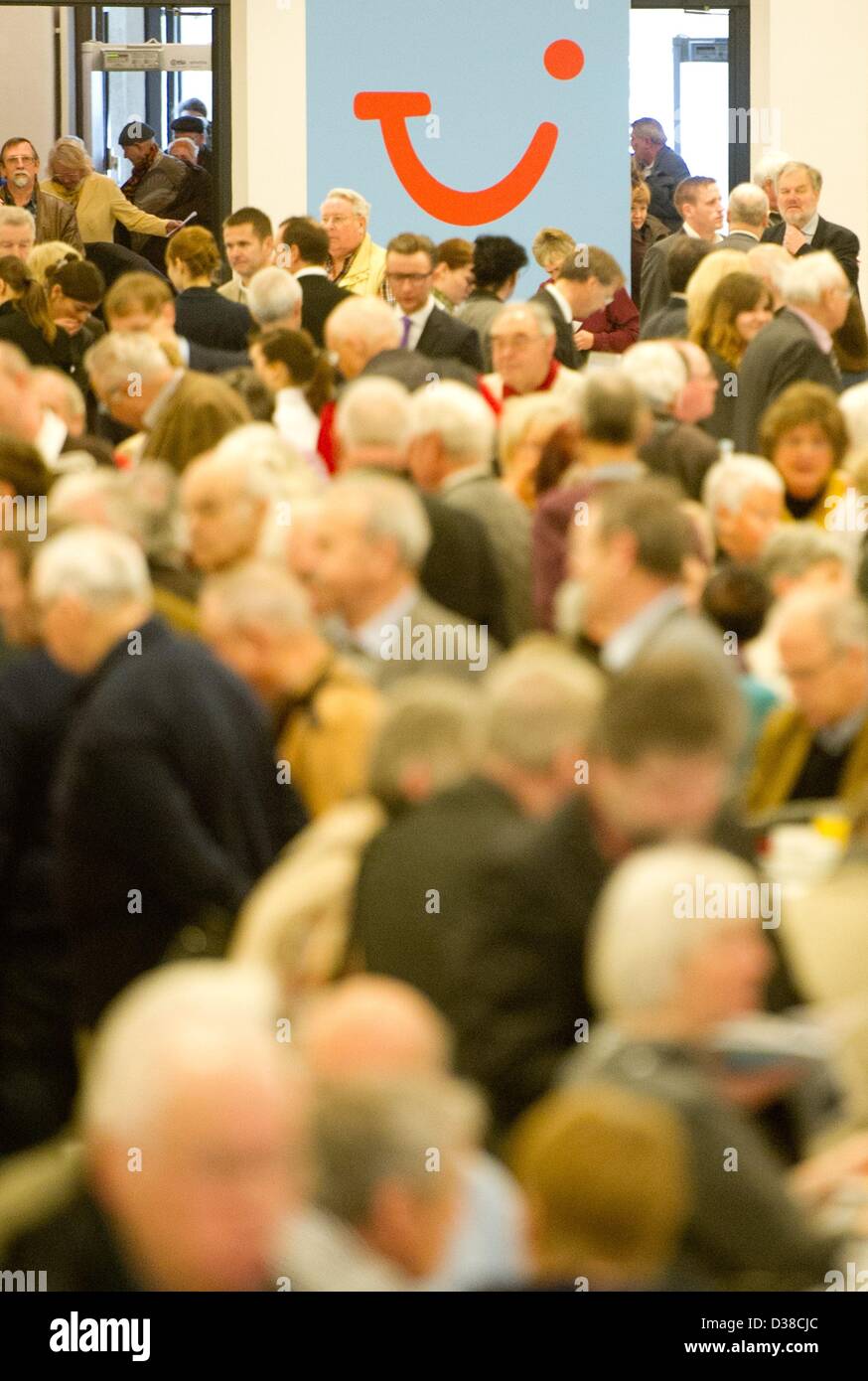 People arrive for the TUI annual general meeting in Hanover, Germany ...
