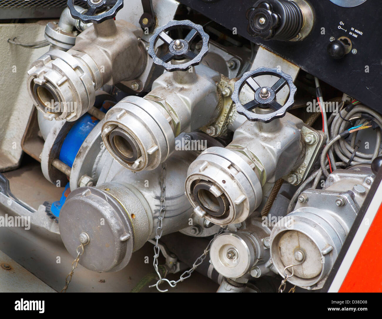 Fire valves at the rear of a fire engine Stock Photo - Alamy