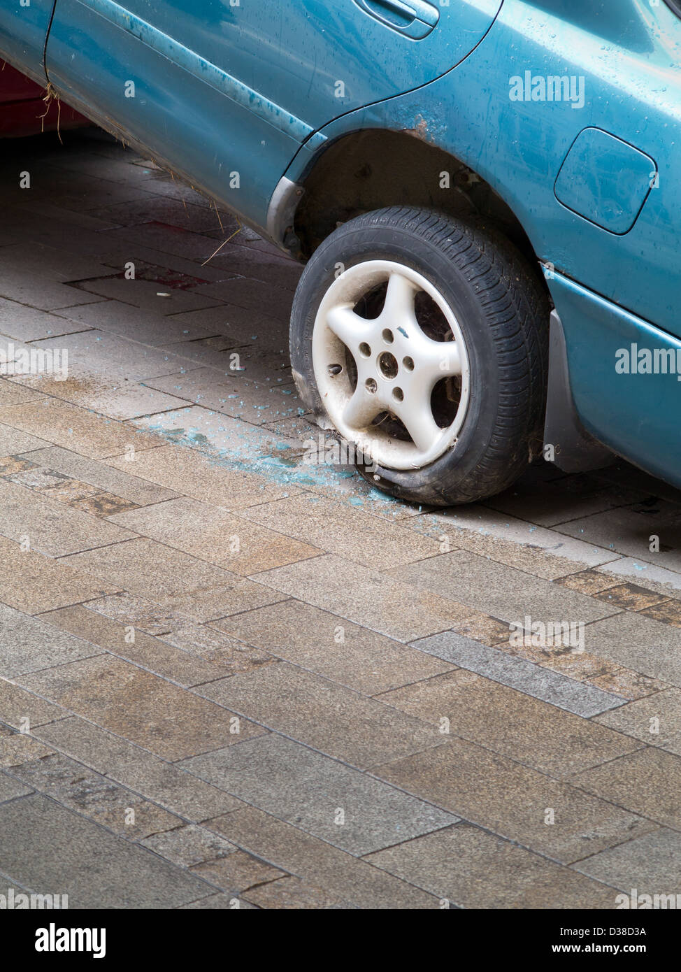 Car punctured hi-res stock photography and images - Alamy