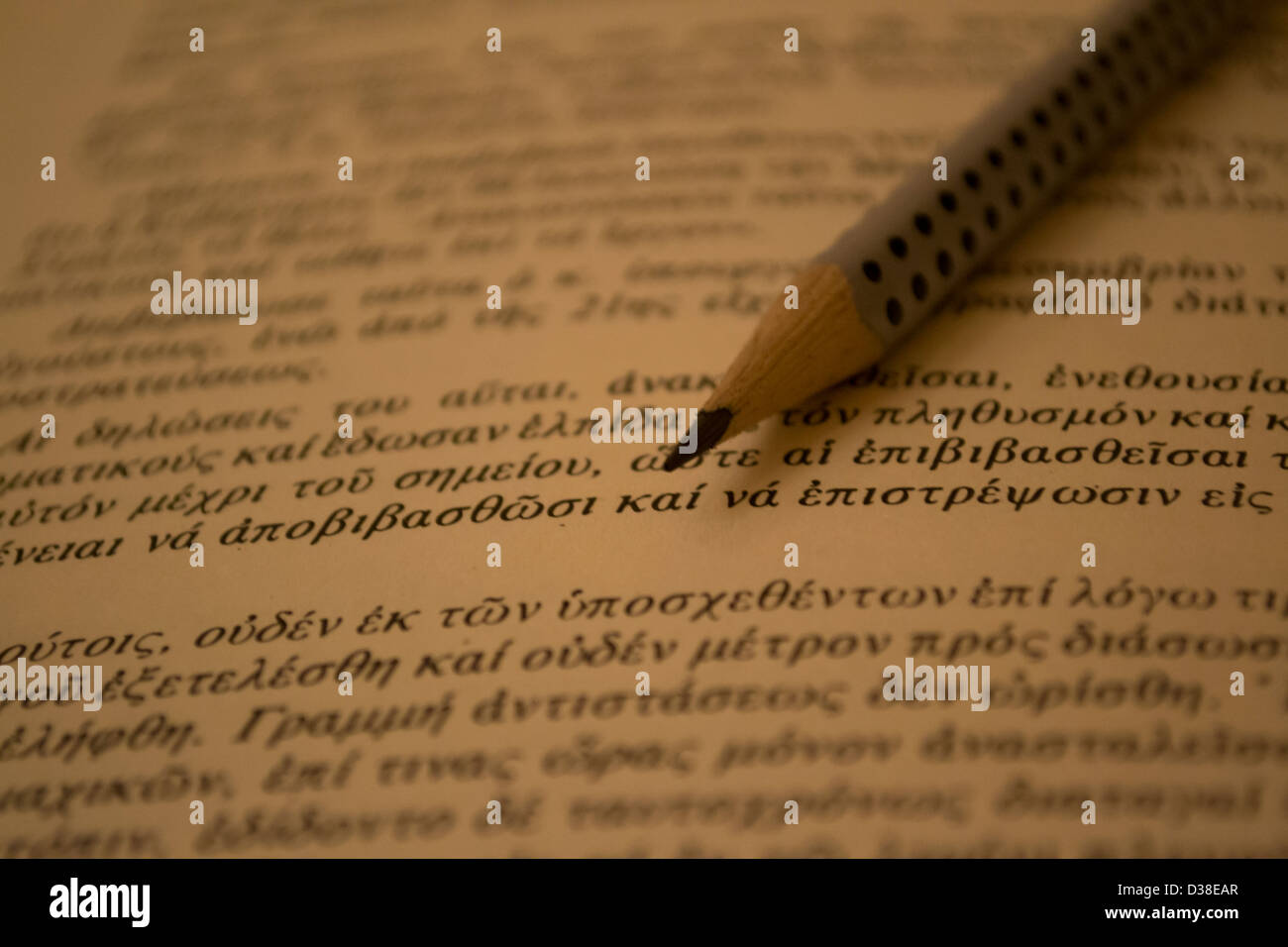 A pencil on a Greek book Stock Photo - Alamy