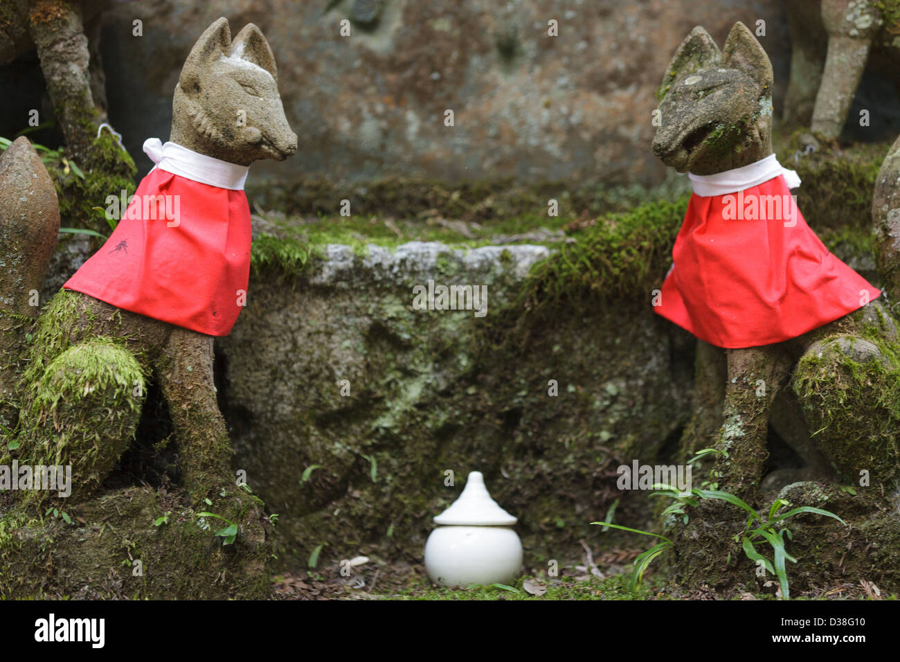 small god fox statue and tombstone in fushimi inari shrine near Kyoto ...