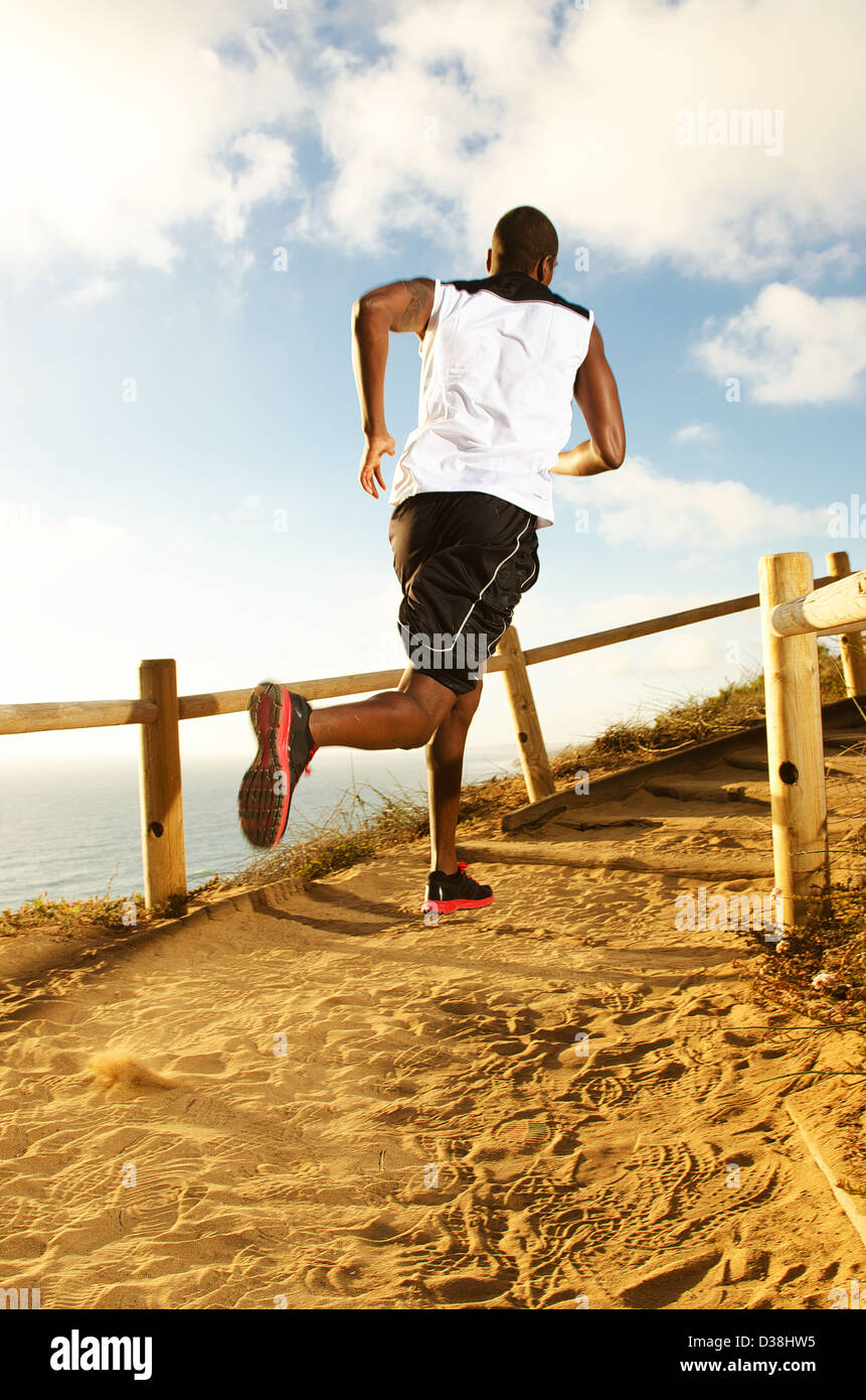 Man running on dirt path Stock Photo - Alamy