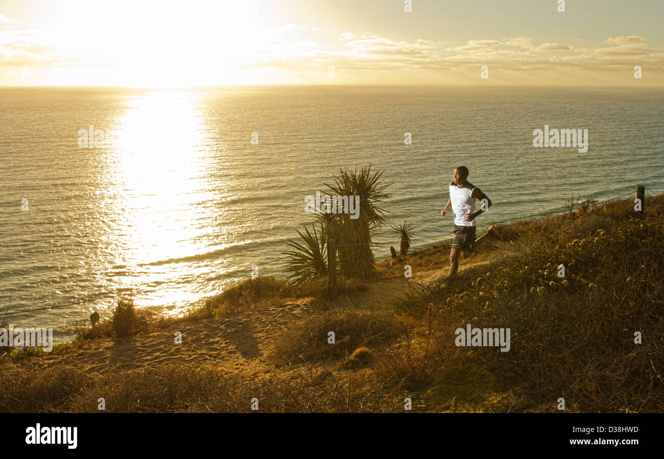Man running on dirt path Stock Photo - Alamy
