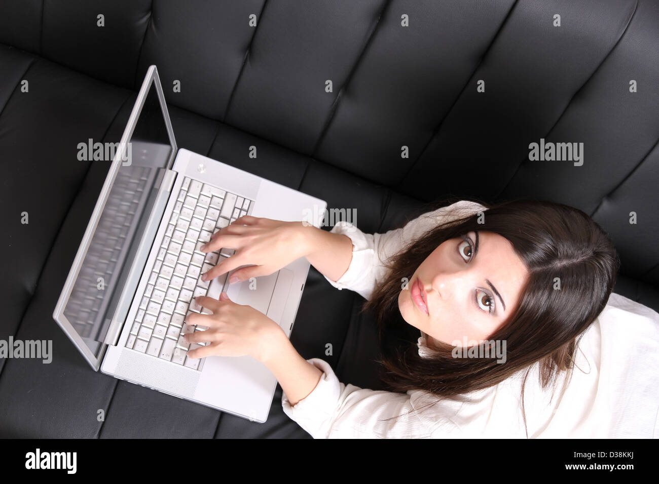 A young woman surfing on the Internet with a Laptop Stock Photo - Alamy
