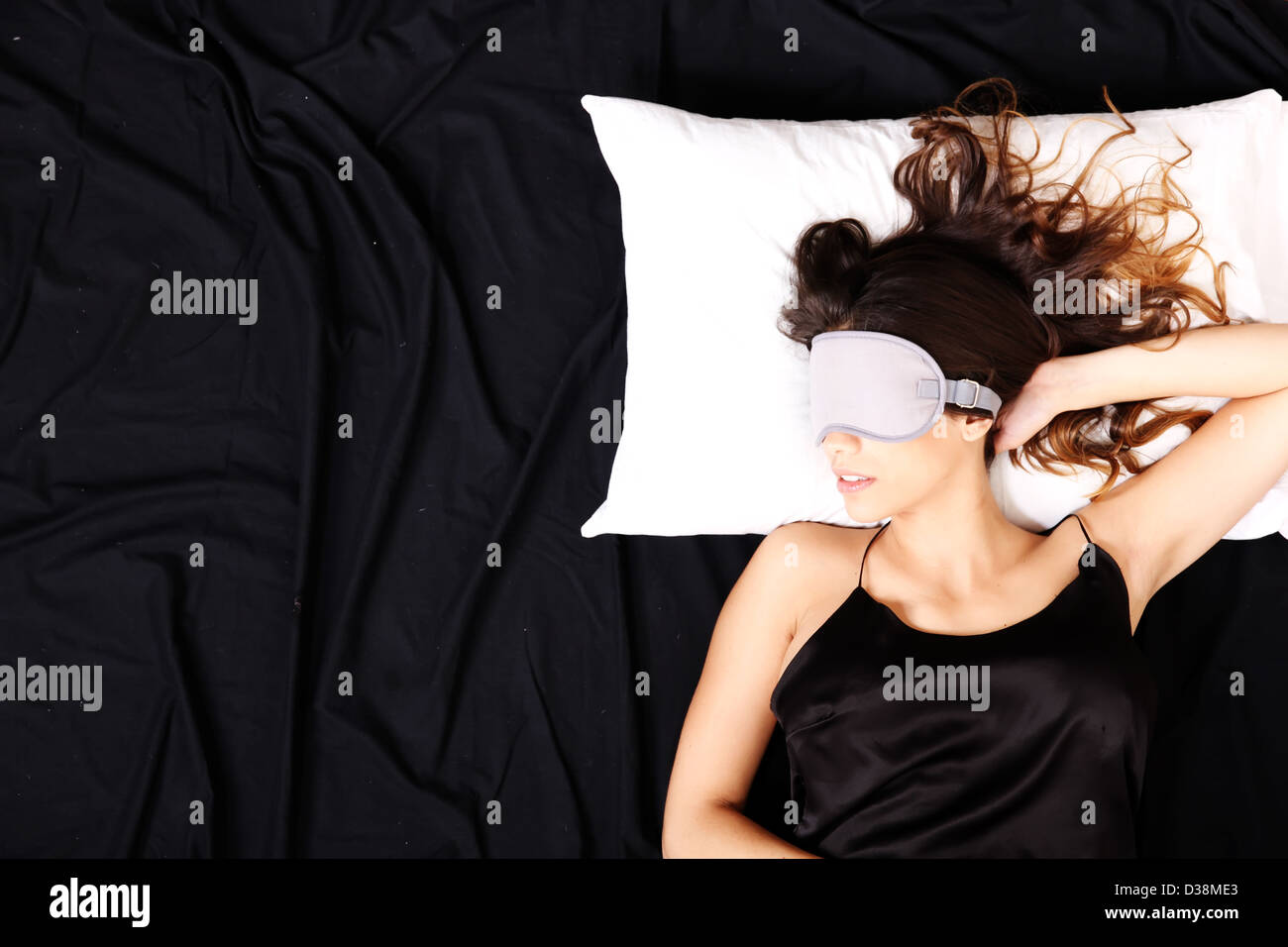 A young woman sleeping with a eye covering mask Stock Photo - Alamy