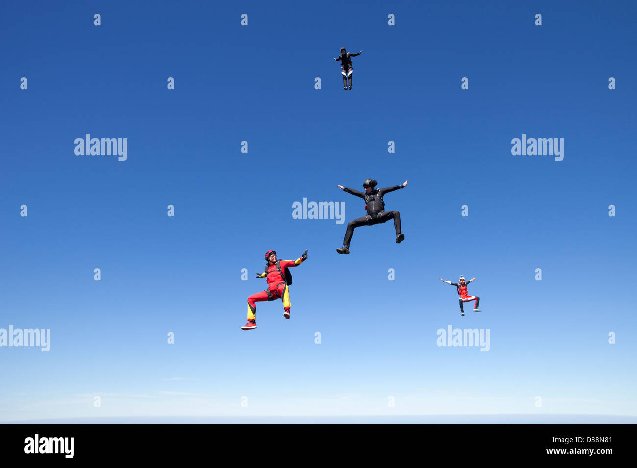 People skydiving over clouds Stock Photo - Alamy