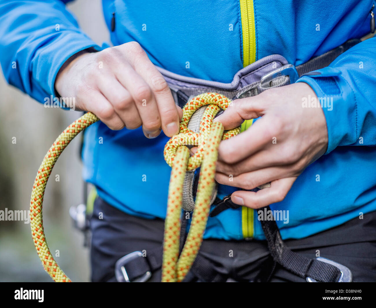 Woman preparing climb tying hi-res stock photography and images - Alamy