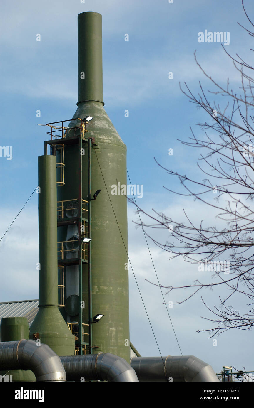 A cooling chimney tower at a chemical factory in England Stock Photo ...