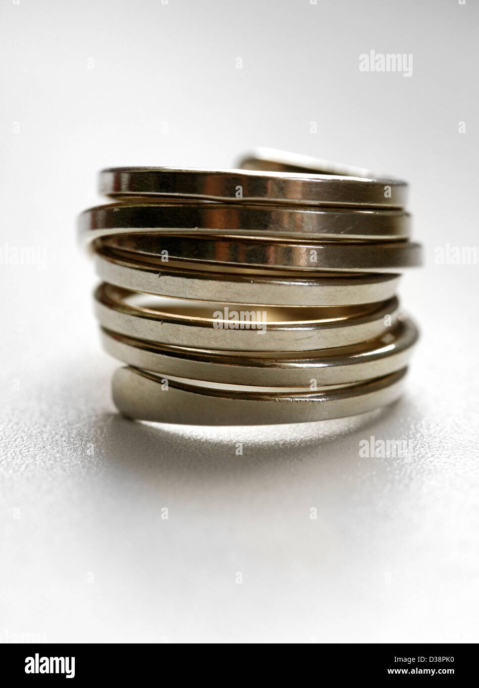 Female silver ring close-up on a light background Stock Photo - Alamy