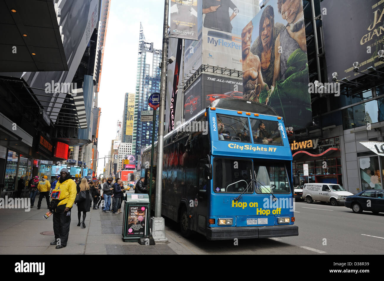 A tour bus on Seventh Avenue at 42nd Street in midtown Manhattan. Feb ...