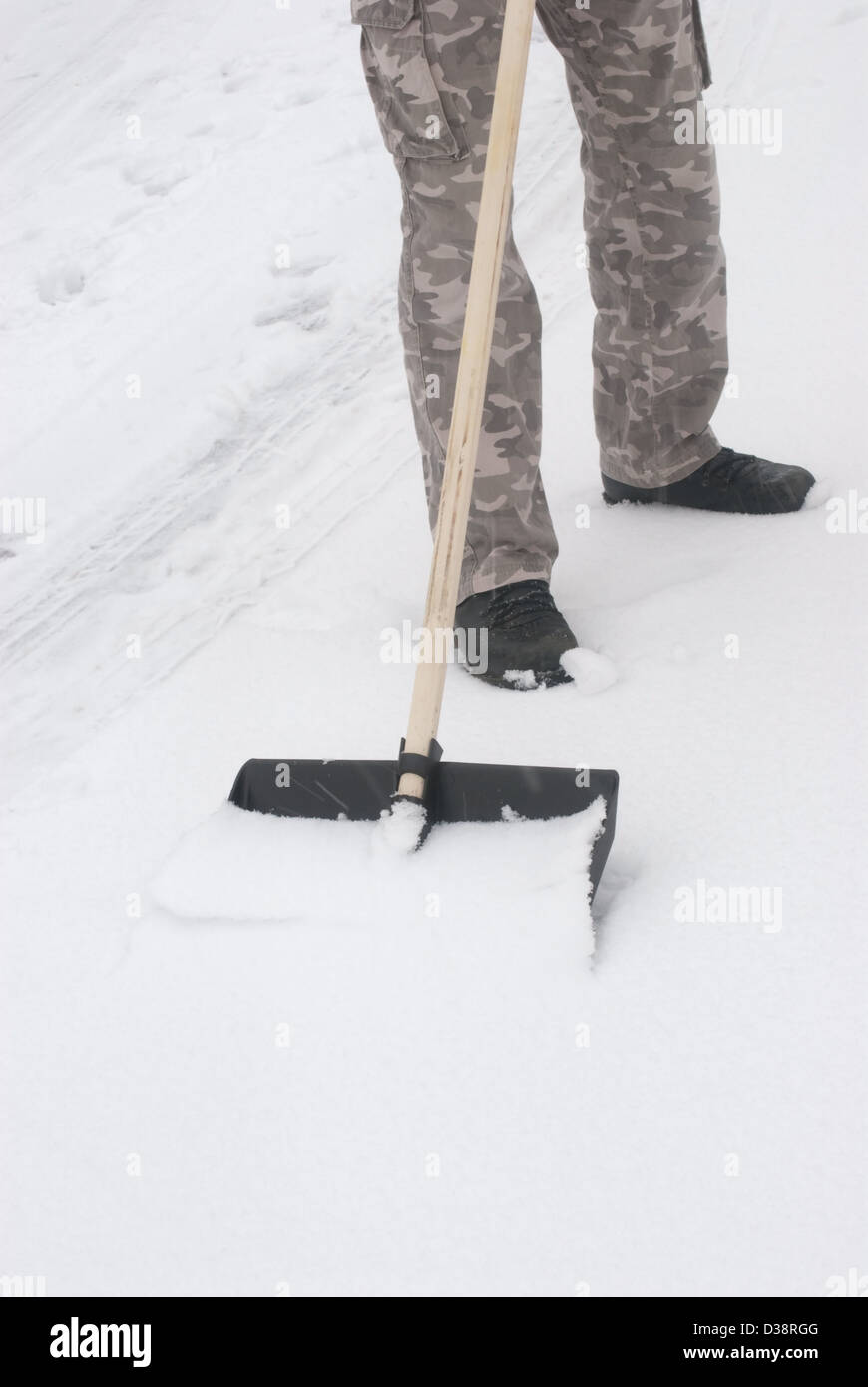 Clearing snow with shovel hi-res stock photography and images - Alamy