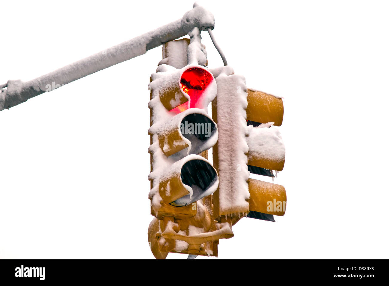Frozen traffic light covered with snow and ice. Red light Stock Photo ...