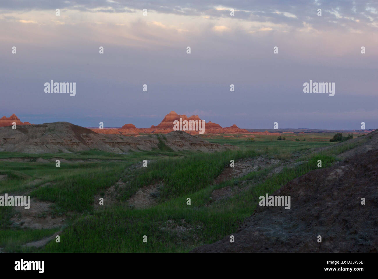 A sunset view behind the butte formations of Badlands National Park in ...