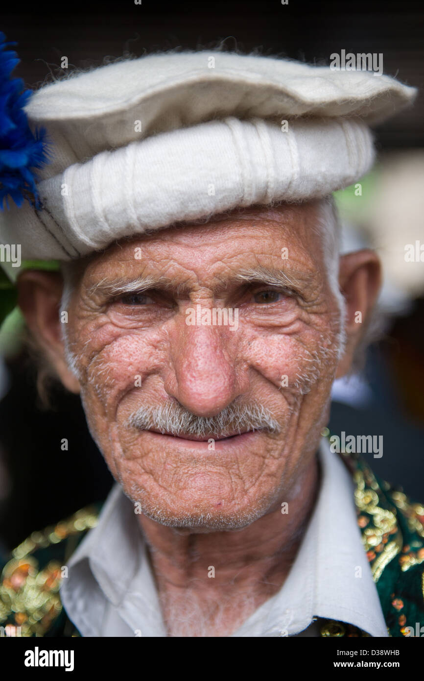 Elder Kalash man wearing a traditional cap at the Anish Brun Village ...