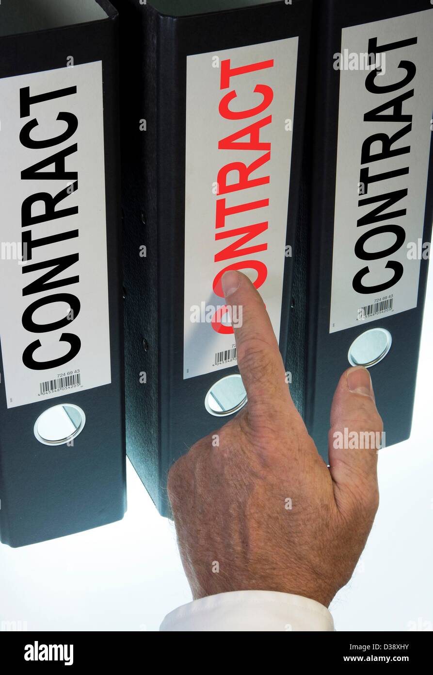 Symbol image,hand pointing to a file folder labeled Contract Stock ...