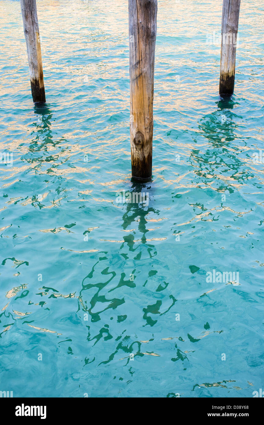 Wooden Mooring Posts and Reflections in the Grand Canal Venice Italy ...