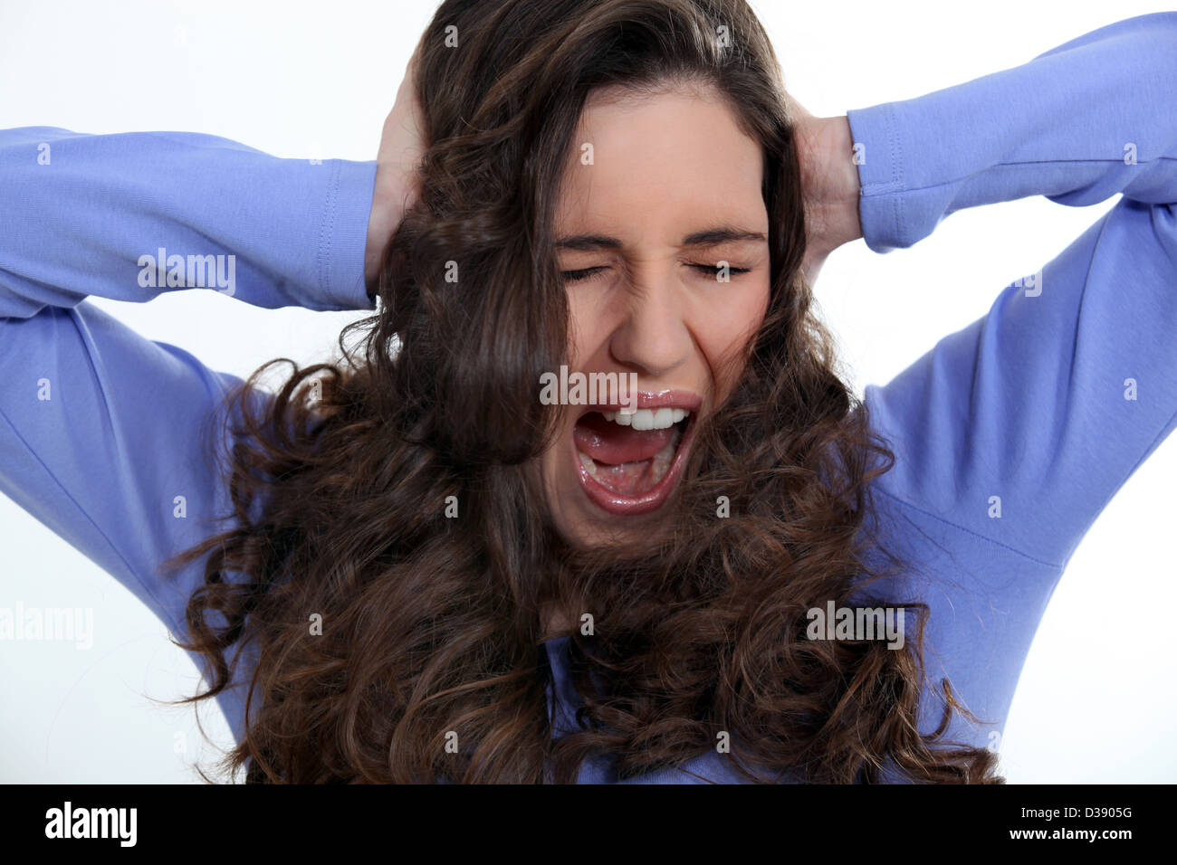 Angry woman with curly hair Stock Photo - Alamy