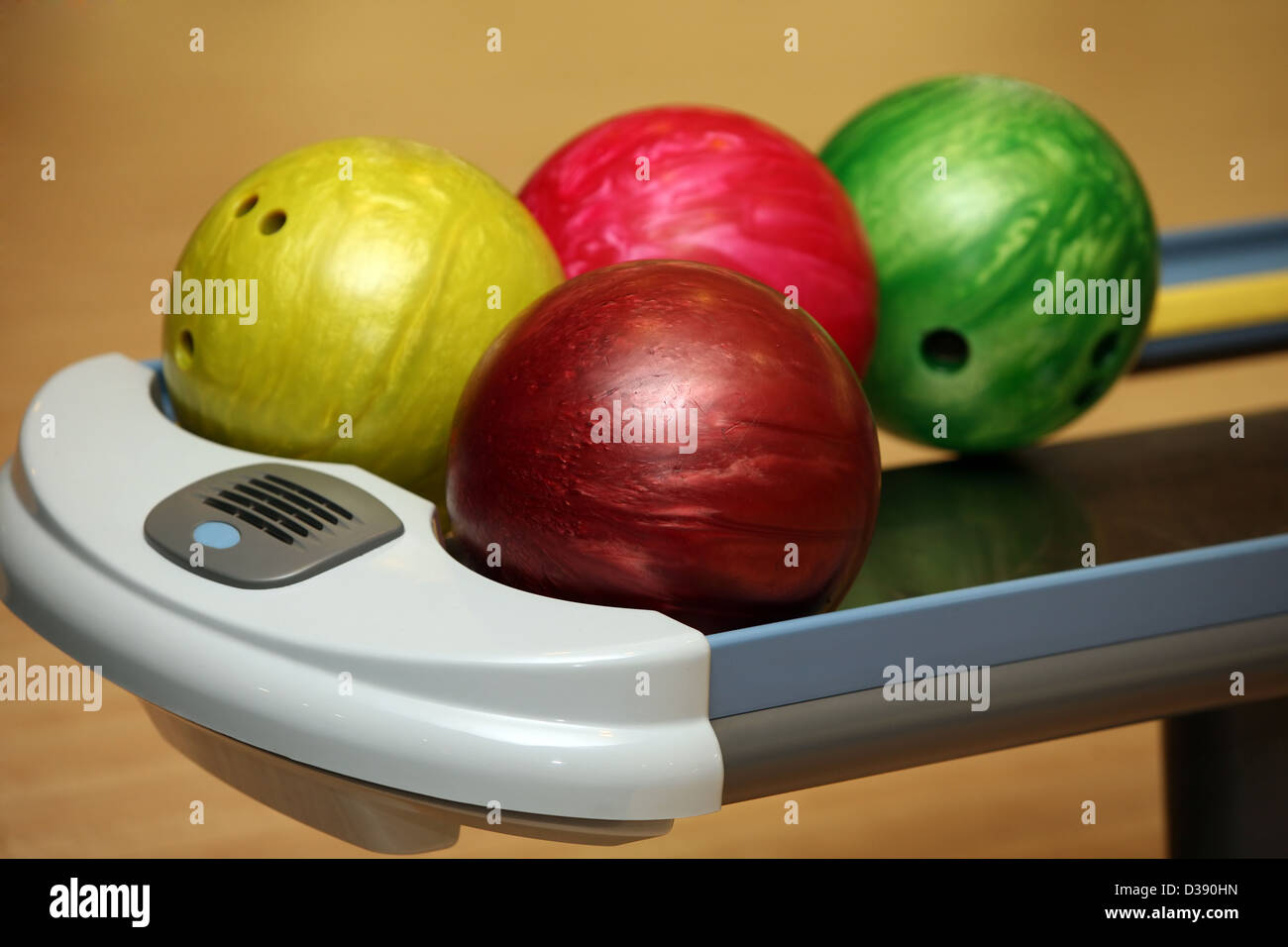 Four color bowling balls of different color Stock Photo - Alamy