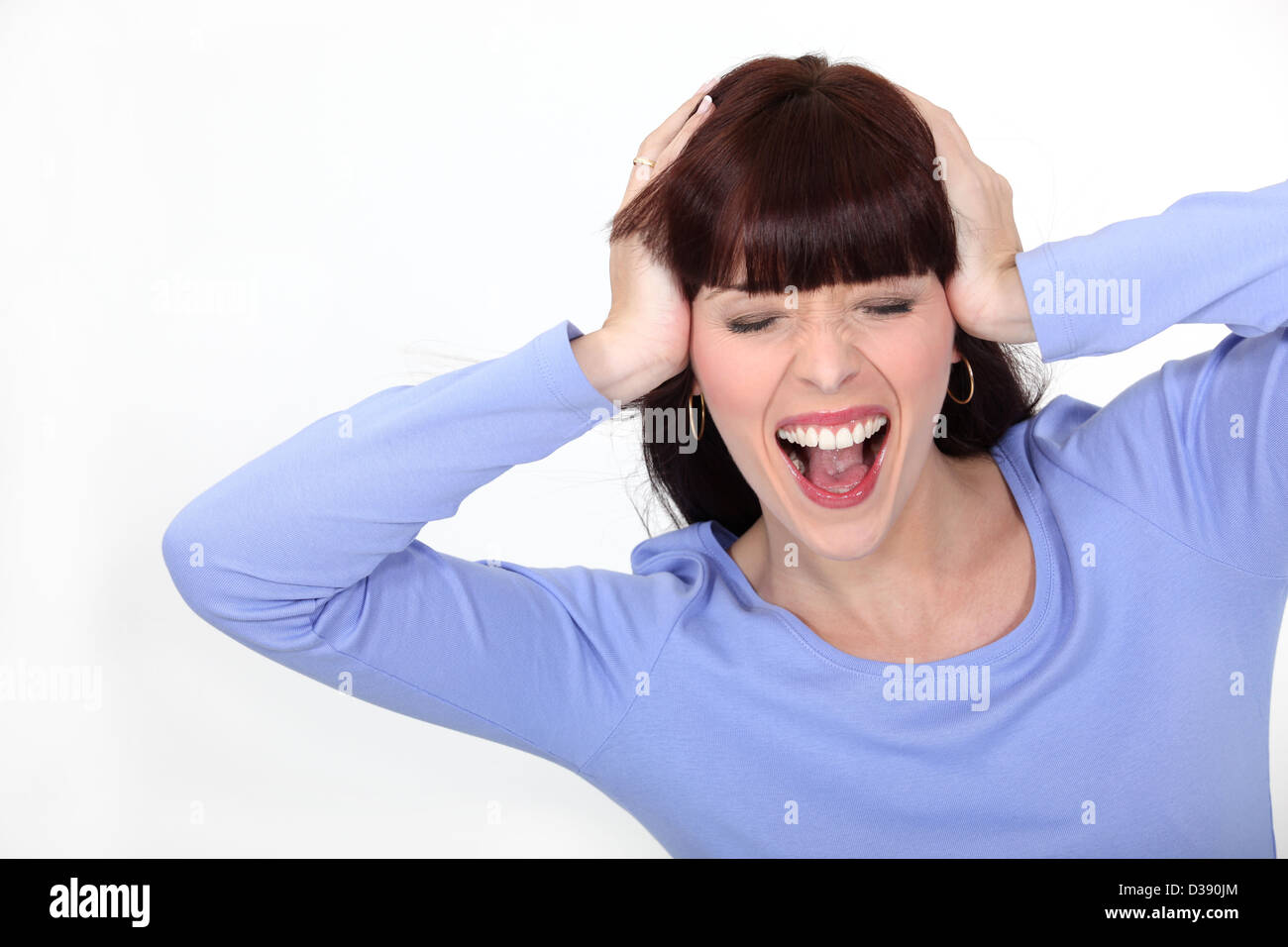Woman covering her ears Stock Photo - Alamy