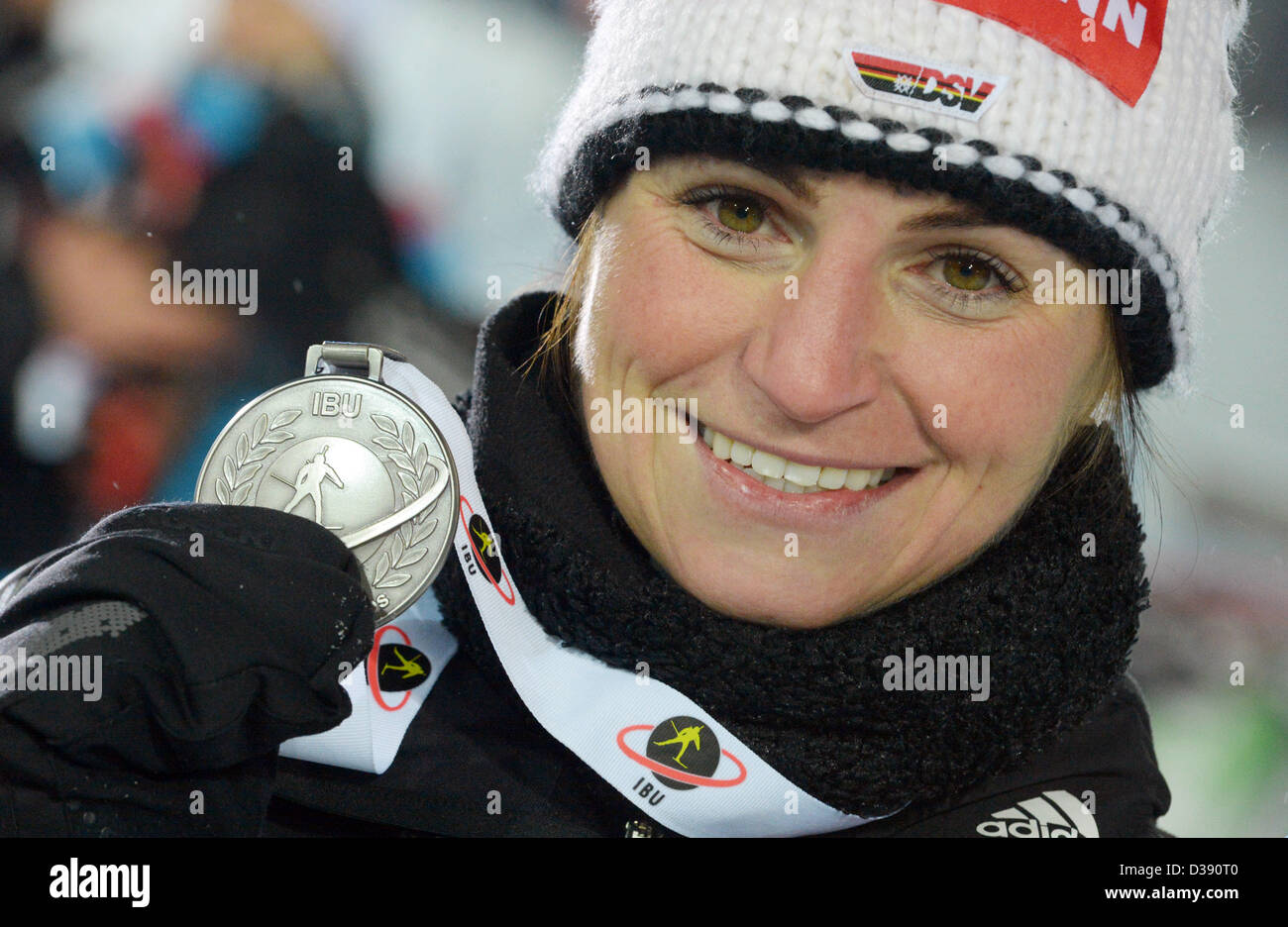 Andrea Henkel of Germany shows the silver medal after the women's 15 km ...