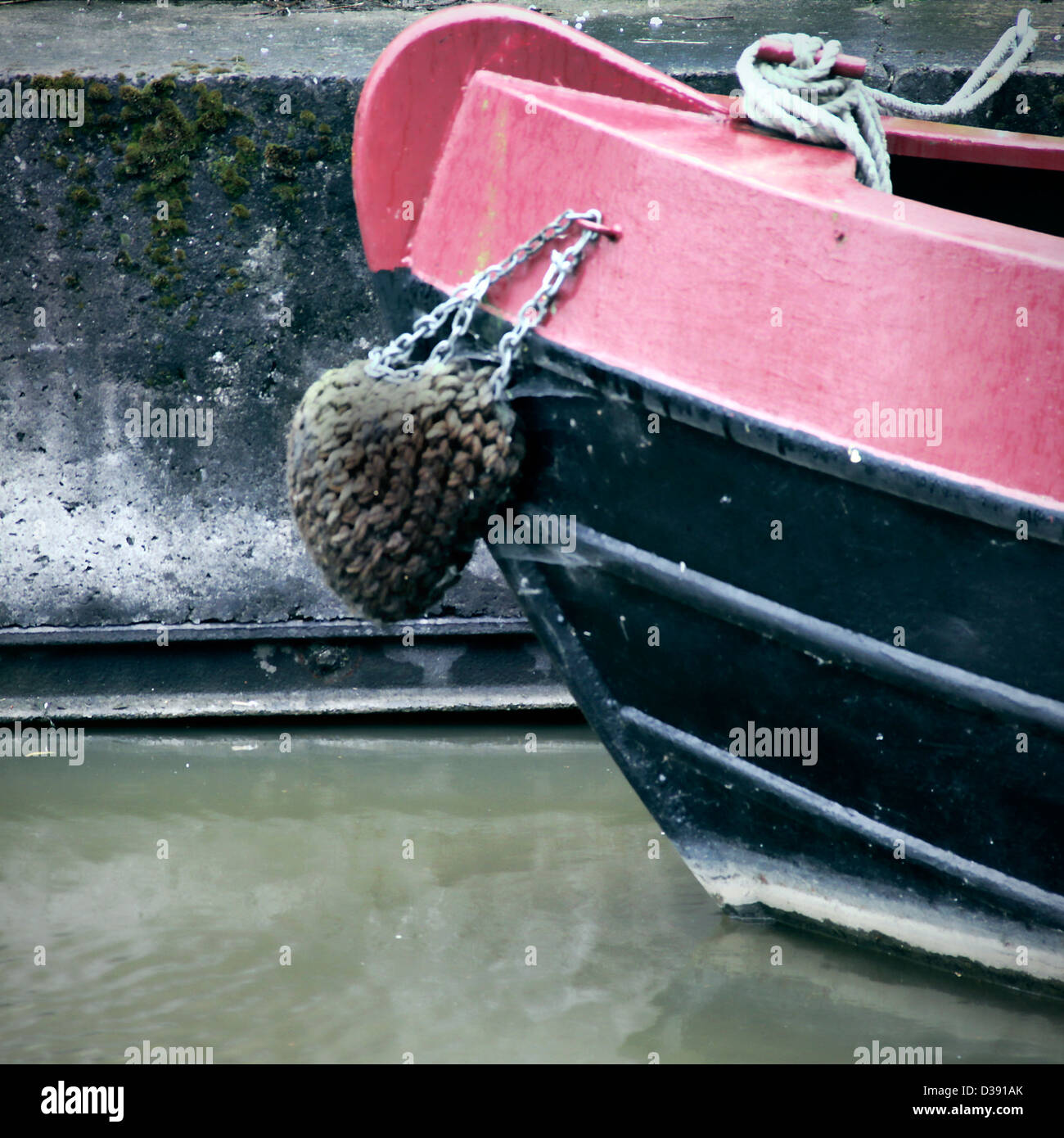 Front of a red and black barge on a canal Stock Photo - Alamy