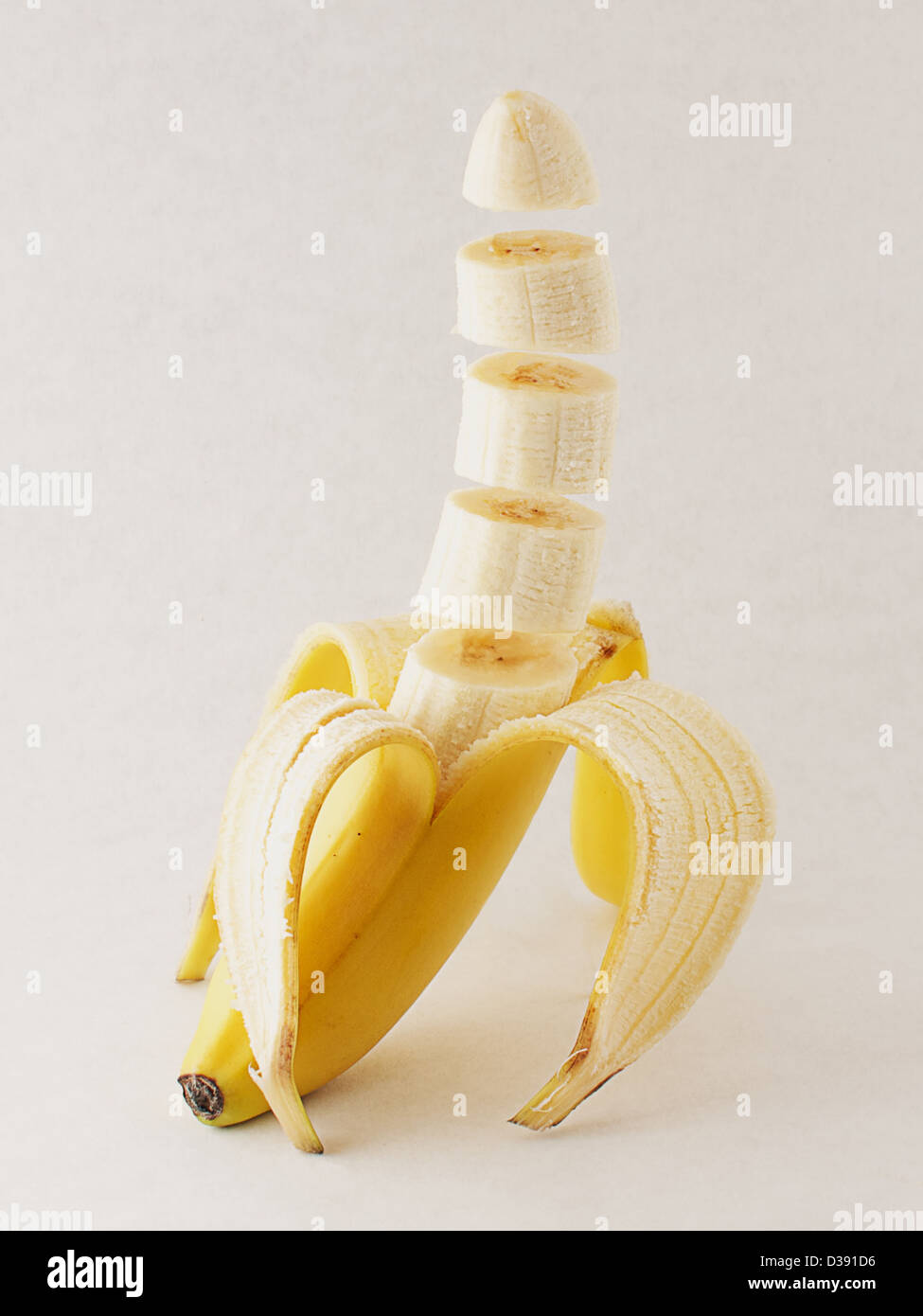 Sliced banana with floating slices Stock Photo - Alamy