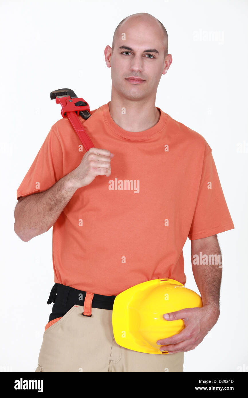 Man with an adjustable wrench Stock Photo - Alamy