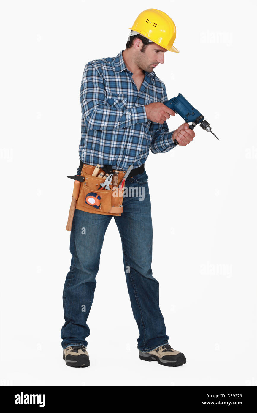 Man holding drill Stock Photo - Alamy