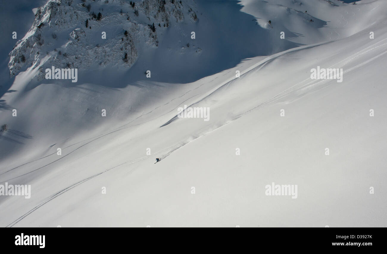 Man enjoying deep powder snow skiing hors piste at Saint-Lary, high ...