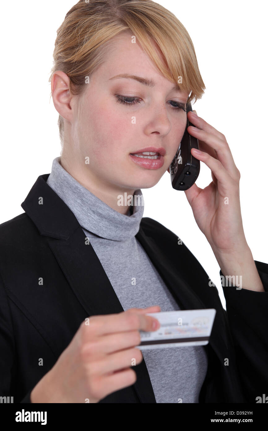 Woman calling her credit card company Stock Photo - Alamy
